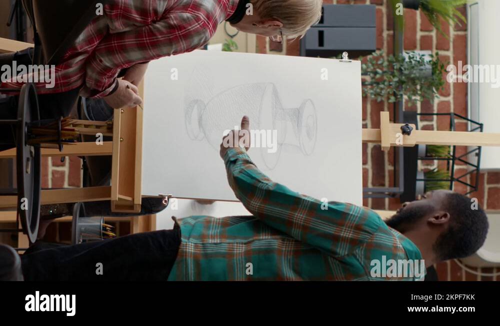 Vertical video: Modern artist analyzing vase drawing by senior woman ...