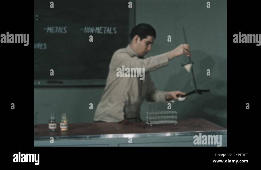 1940s: Chemist places test tube in rack and removes apparatus from ...