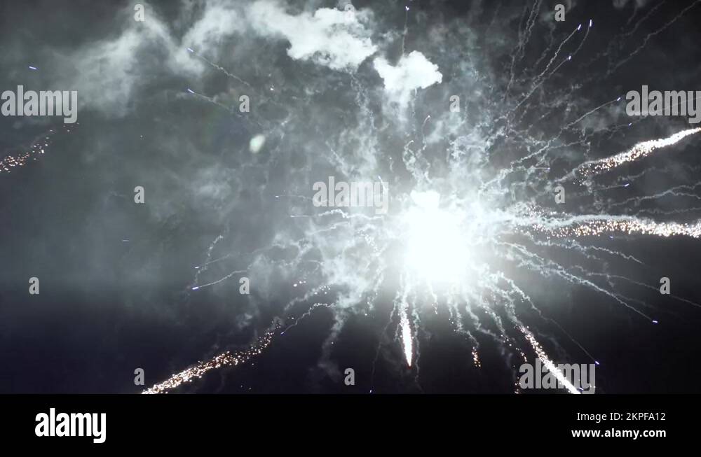 Shining fireworks with bokeh lights in the night sky close up ...