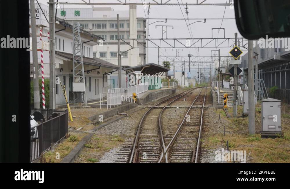 Japanese local train arriving in countryside of Shiga, Toyosato Station ...