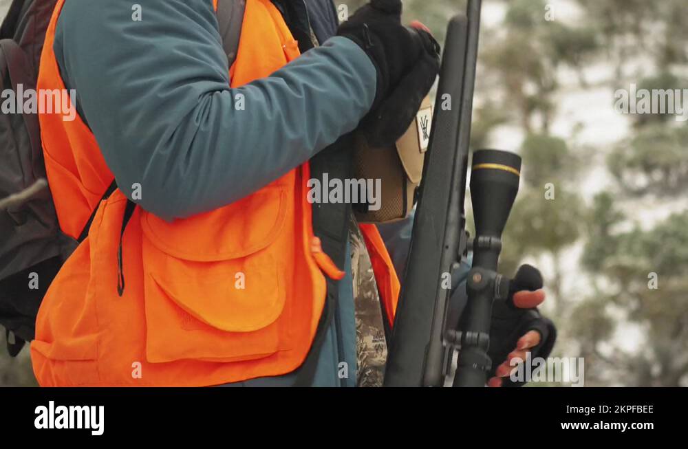 Hunter Preparing For Hunting Trip By Taking His Rifle With Him Stock ...
