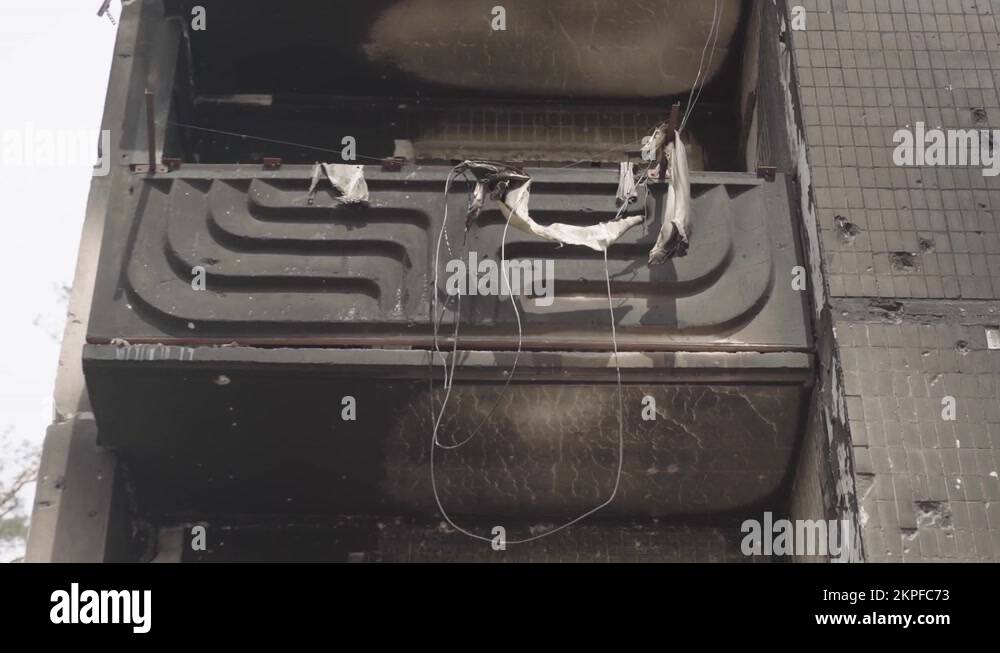 A bombed-out apartment building after an airstrike. War in Ukraine ...