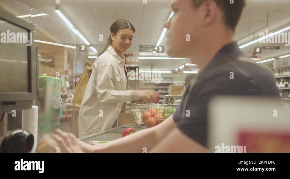 Cashier serving customer supermarket checkout Stock Videos & Footage ...