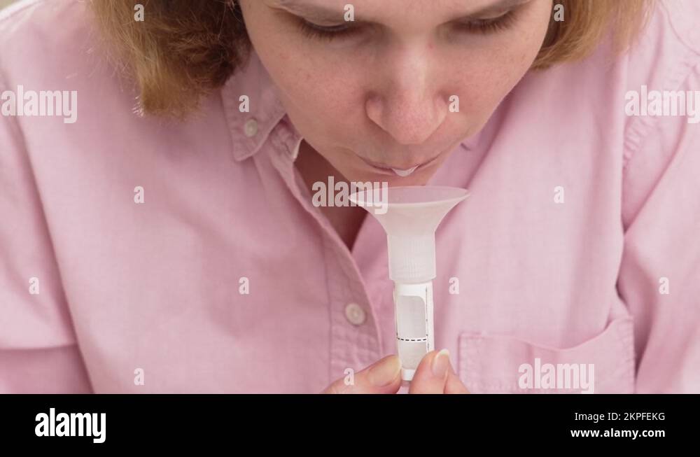a woman collects saliva in a container for a dna test Stock Video ...