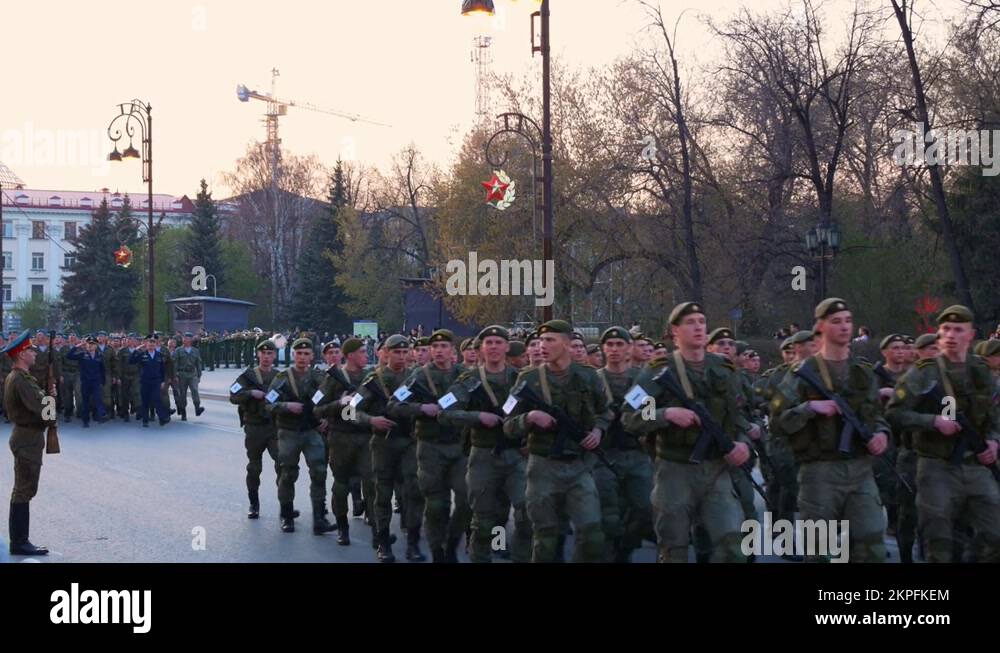 The Russian military with Kalashnikov assault rifles march in formation ...