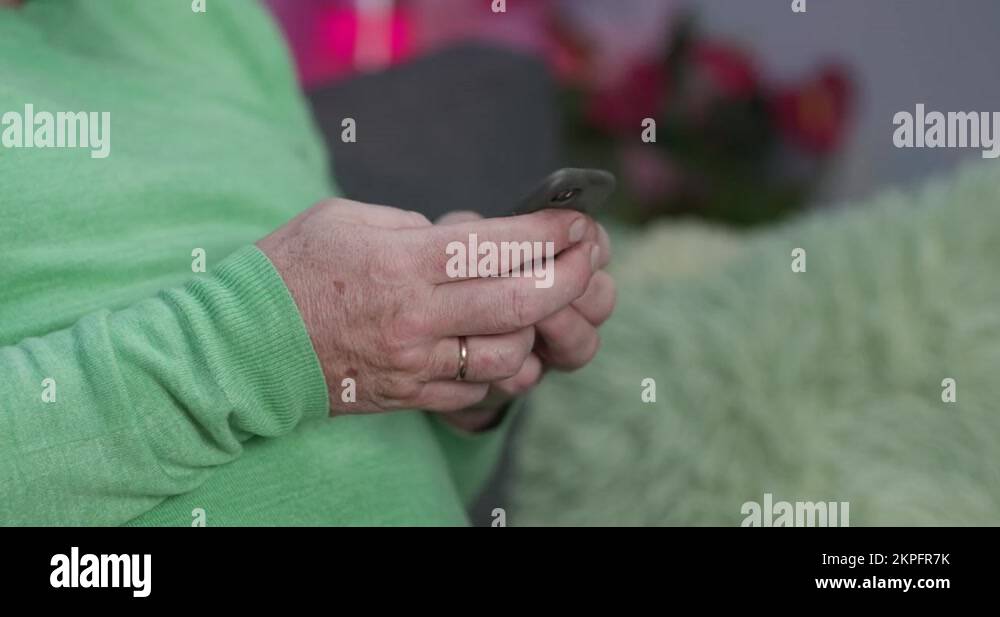 Old man hold black smartphone and touch screen. Middle aged older man ...