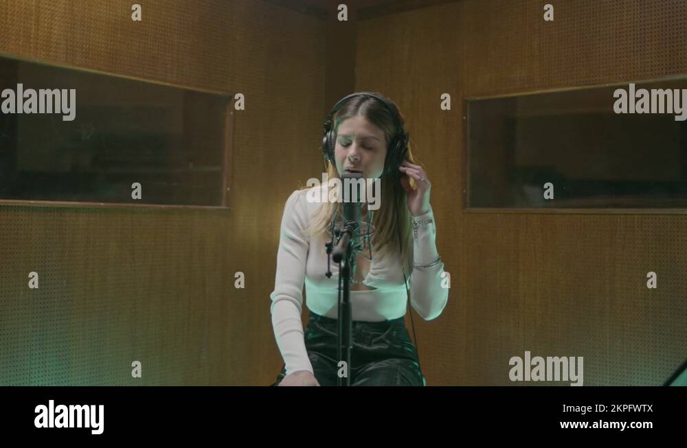 Beautiful female singer working in music studio Stock Video Footage - Alamy