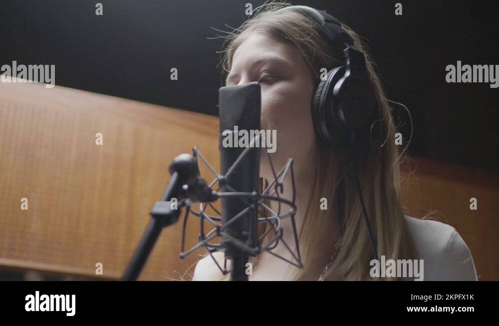 Beautiful female singer working in music studio Stock Video Footage - Alamy