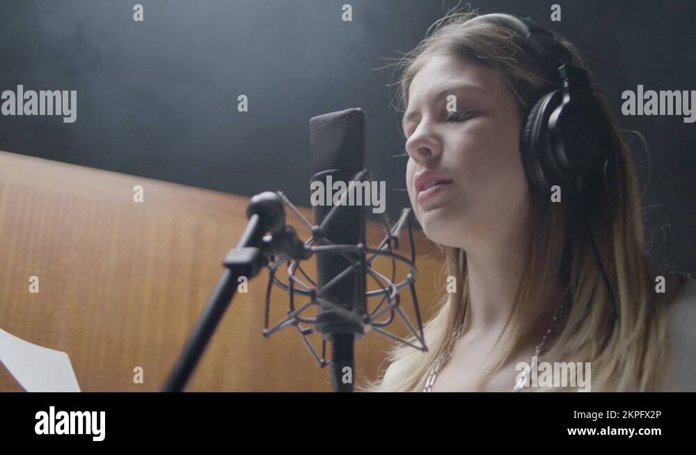 Beautiful female singer working in music studio Stock Video Footage - Alamy