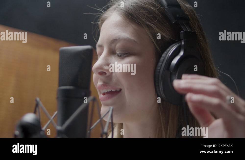 Beautiful female singer working in music studio Stock Video Footage - Alamy