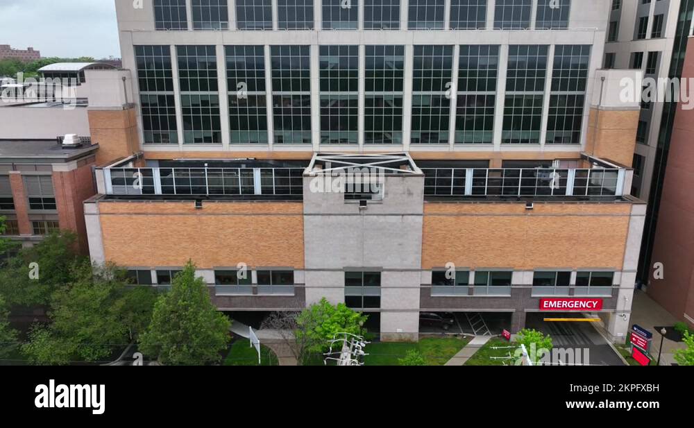 Rising aerial view of emergency sign at hospital. Large medical center ...