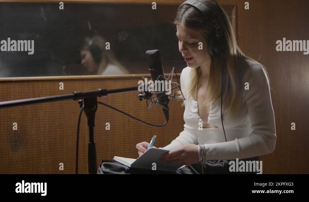 Beautiful female singer working in music studio Stock Video Footage - Alamy