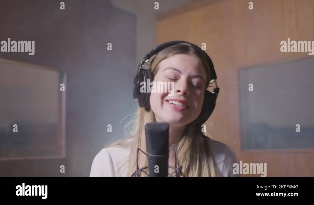 Beautiful female singer working in music studio Stock Video Footage - Alamy