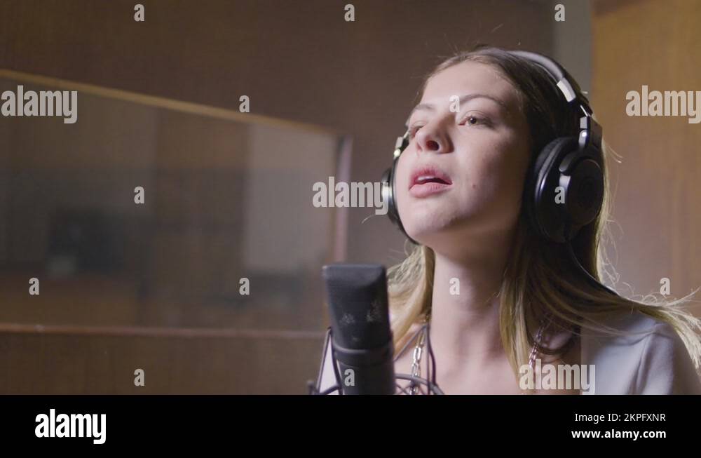 Beautiful female singer working in music studio Stock Video Footage - Alamy