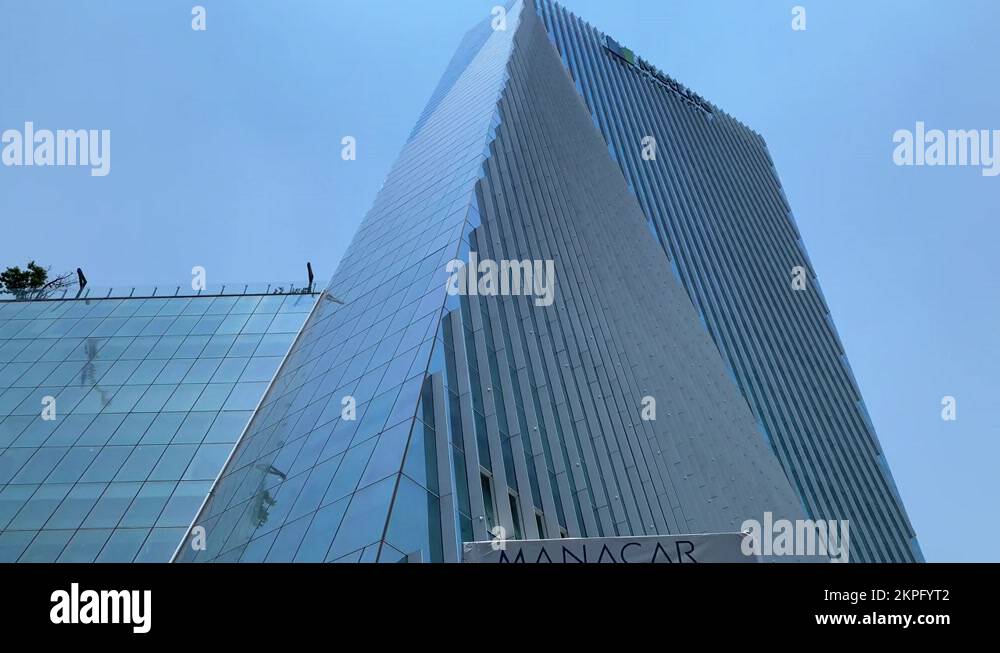 Tilt Down From Looking Up At Top Of Torre Manacar Building Against ...