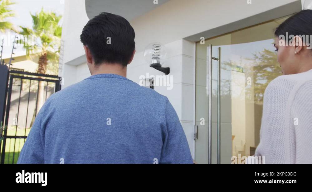 Video of back view of diverse couple opening door to new house Stock ...