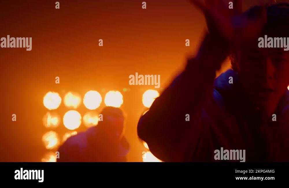 Cool guys team dancing emotionally for talent show. B-boys performing ...