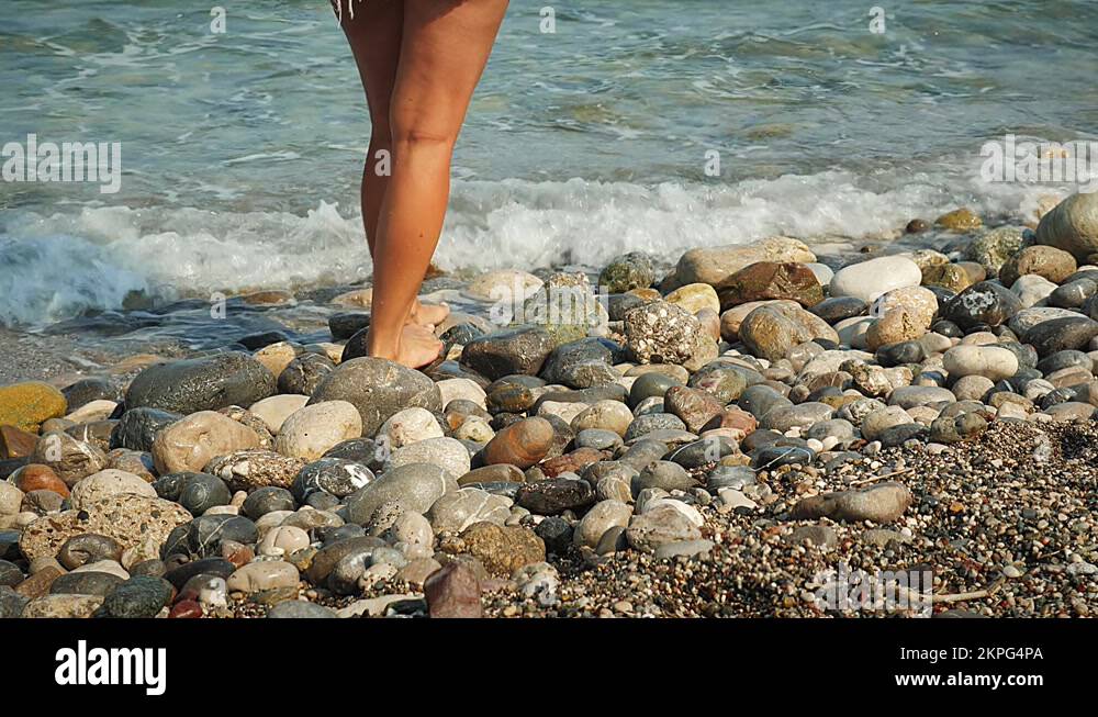 Slim Female Legs Walking Along Seashore Woman Barefoot Walking On