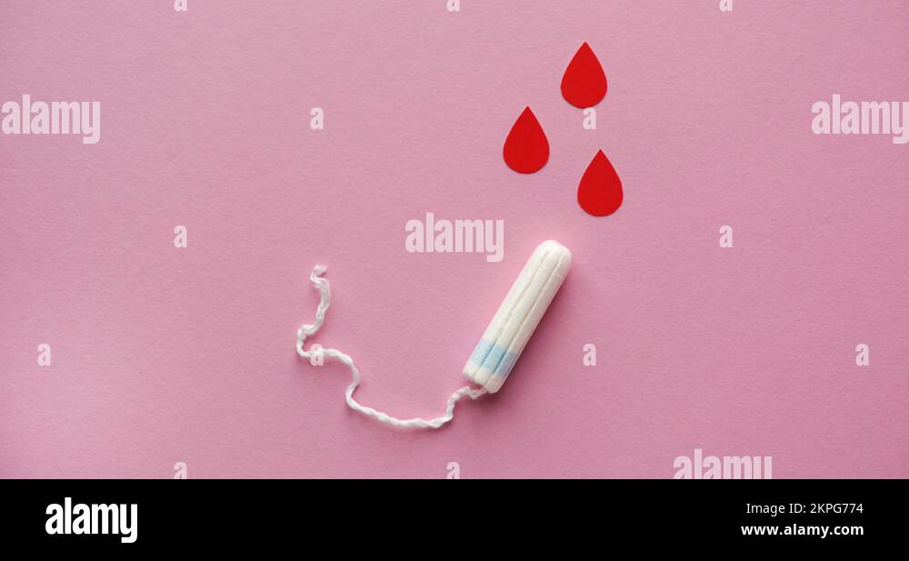 Feminine hygienic tampon and drops of blood. Menstrual cycle Stock ...