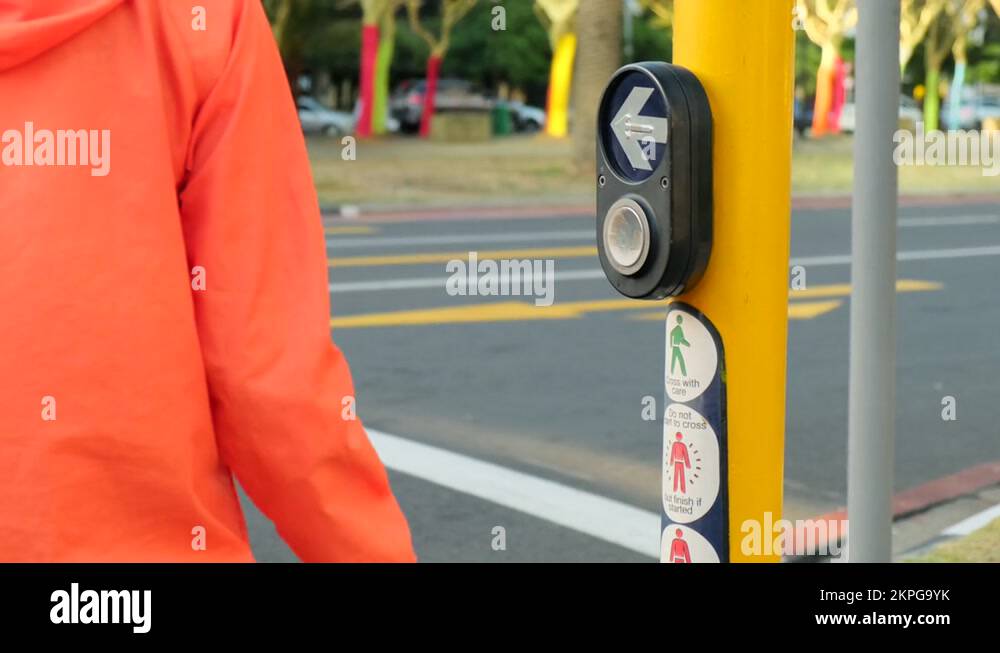 close-up of woman's hand pressing a button on a traffic light Stock ...