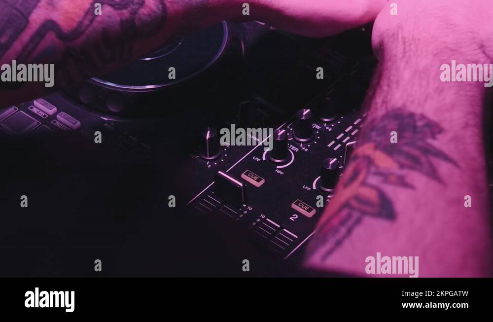 DJ's hands close-up in a nightclub. DJ mixing tracks on stage. Close-up ...