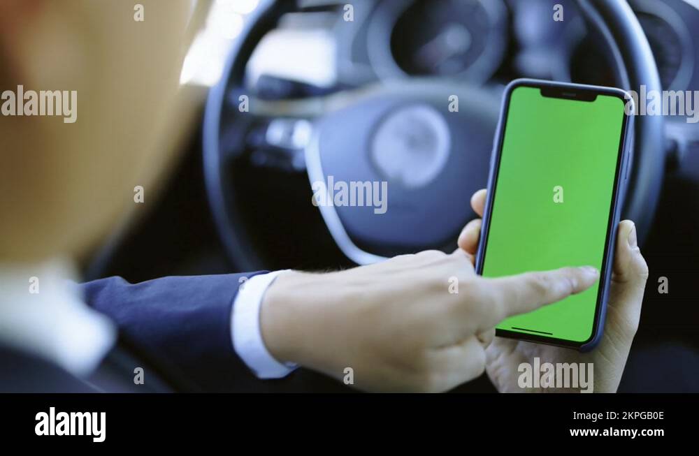 Back view of male hand touching, sliding on chroma key green screen ...