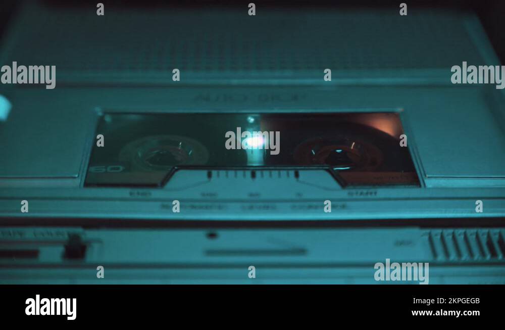 Tape recorder playing back music. Person confessing on a vintage tape ...