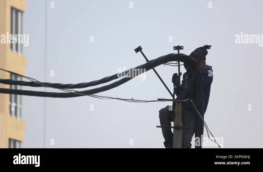 Construction worker installing wires in a new building Stock Video ...