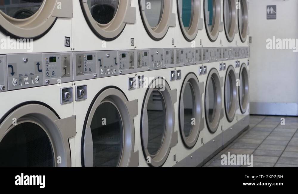 Washing machines, public coin laundry, USA. Self-service laundromat ...