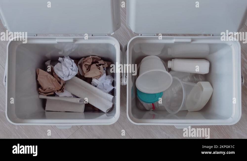 Top view: sorting of garbage in two recycling bins - stop motion animation Stock Video Footage ...