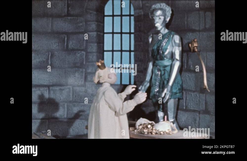 1950s: Puppet king talks to large metal puppet man. Puppet king runs ...