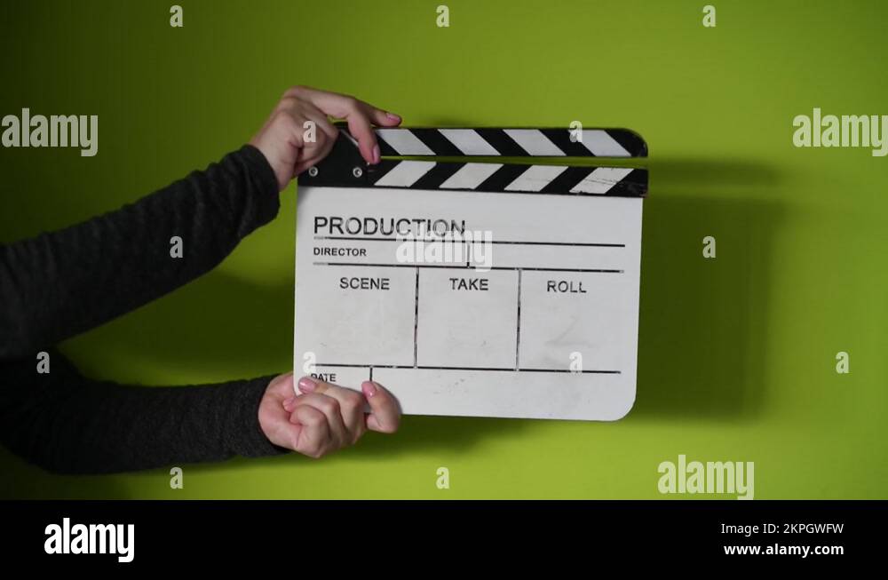 Human hands hold and clap with clapperboard. Beginning of scene in film ...