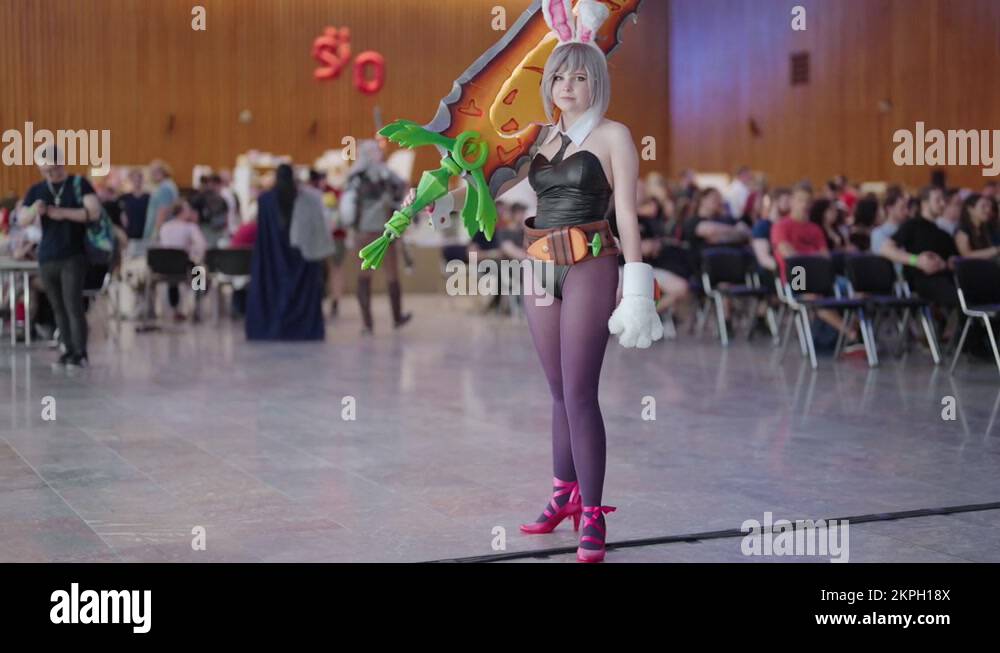Battle Bunny Riven cosplay character girl from game pose at comic con ...