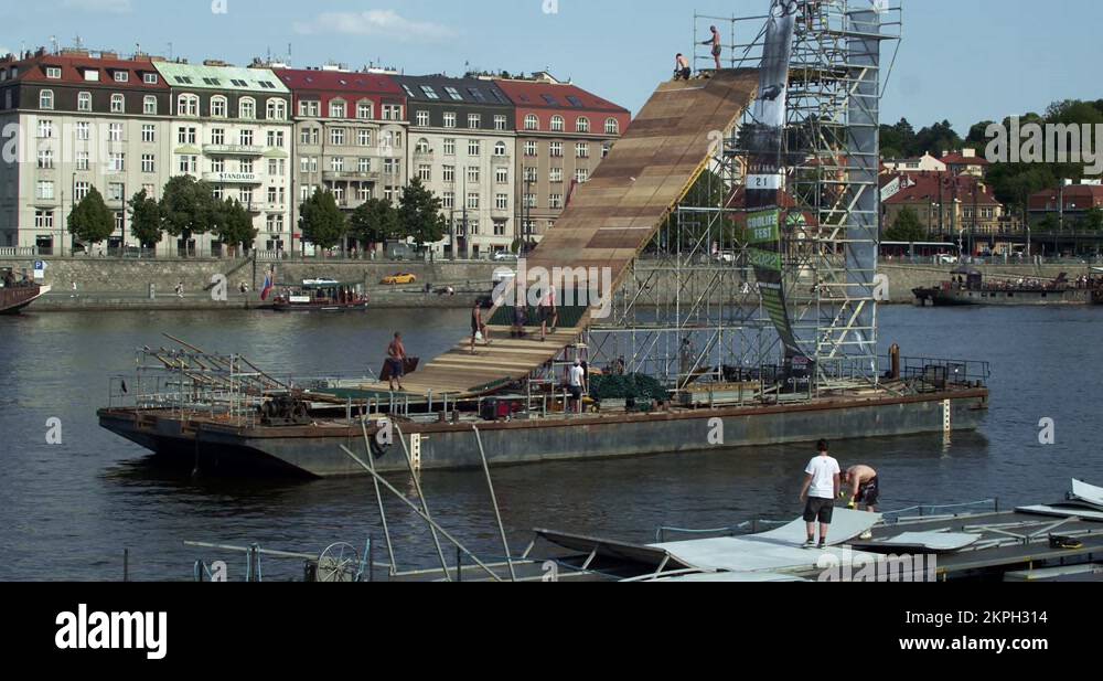 Workers on a pontoon build a ramp on the Vltava River for an extreme ...