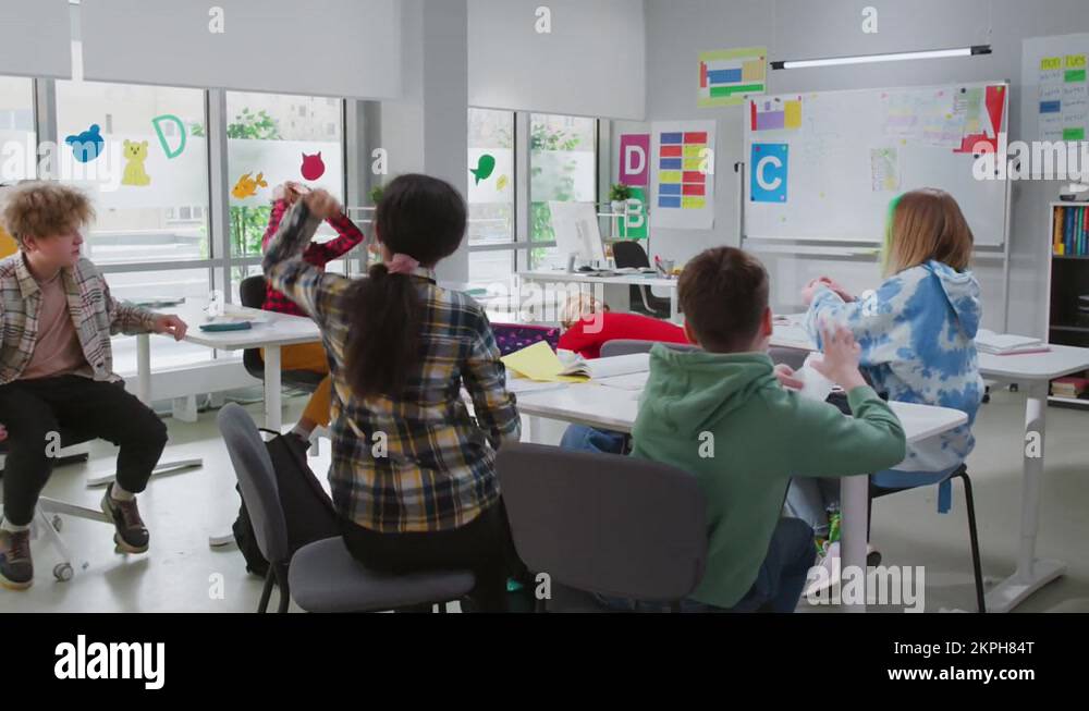 Cheerful students throwing paper Stock Videos & Footage - HD and 4K ...