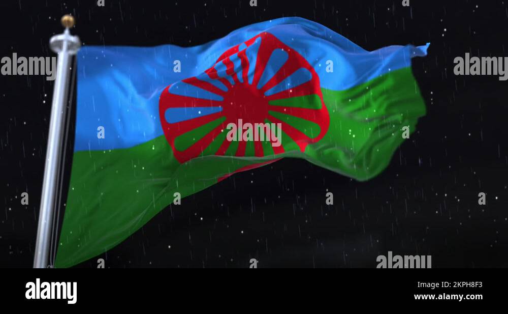 Flag of the Romani people waving with rain and snow in the night. Loop ...
