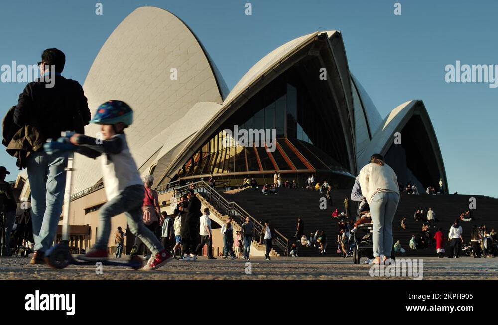 Little child pushes scooter past Sydney Opera House slow motion 4K ...