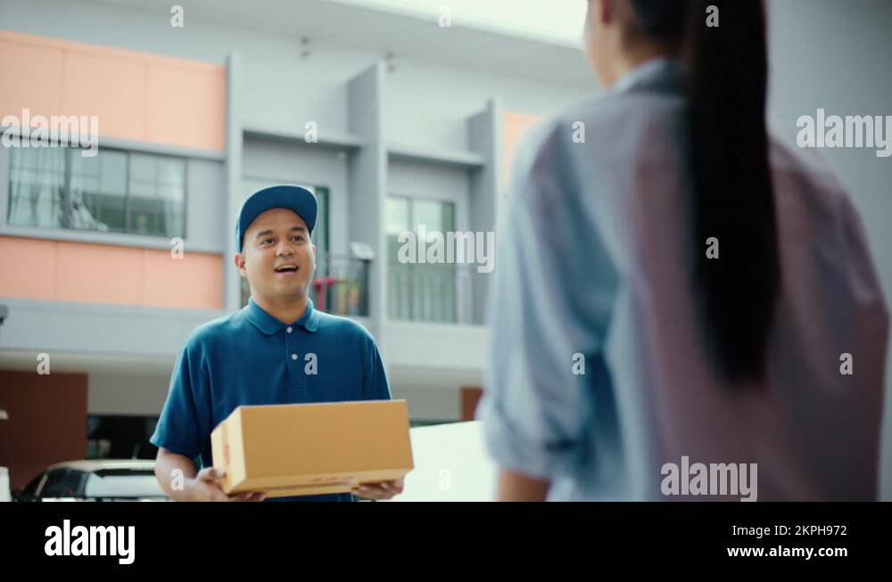 Blue uniform delivery man send parcel to customer front of the house with good Stock Video ...