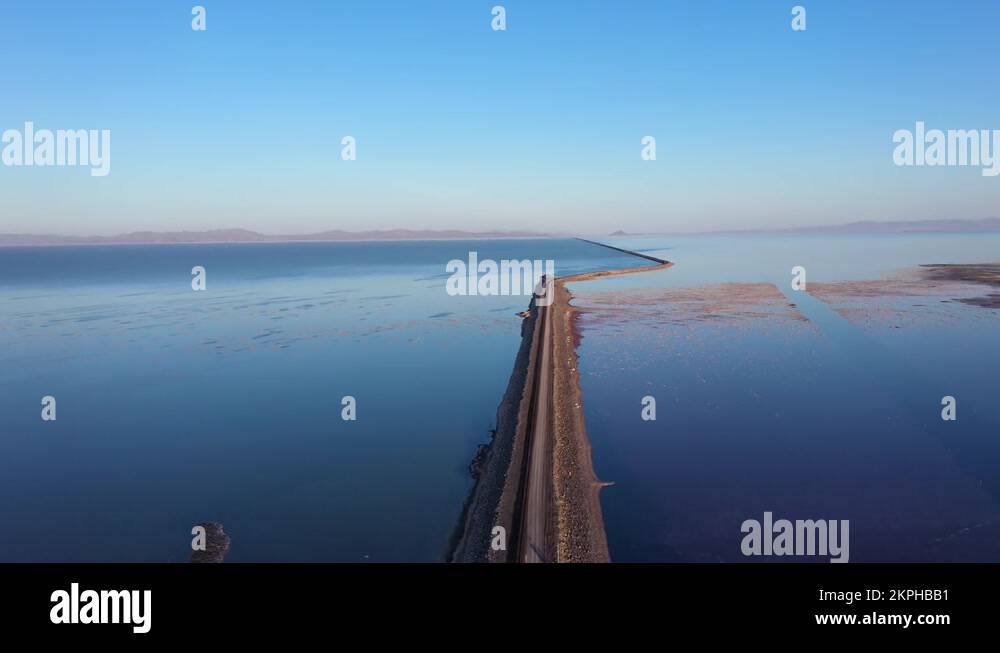 Drone flight over causeway crossing the Great Salt Lake in Utah, blue ...
