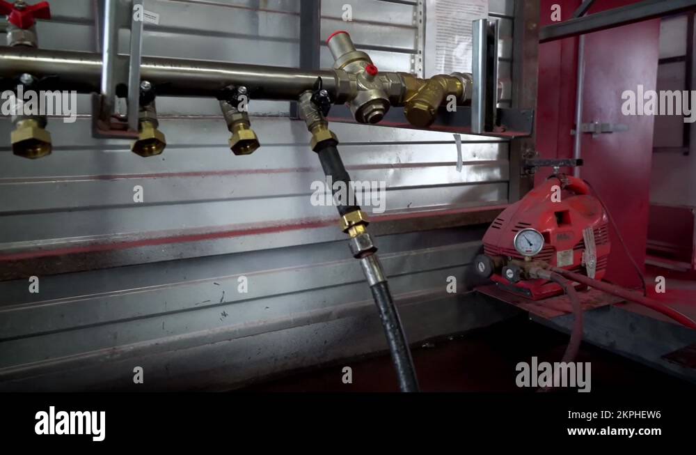 Pressure Gauge Machine is testing the produced steel pipes in the ...