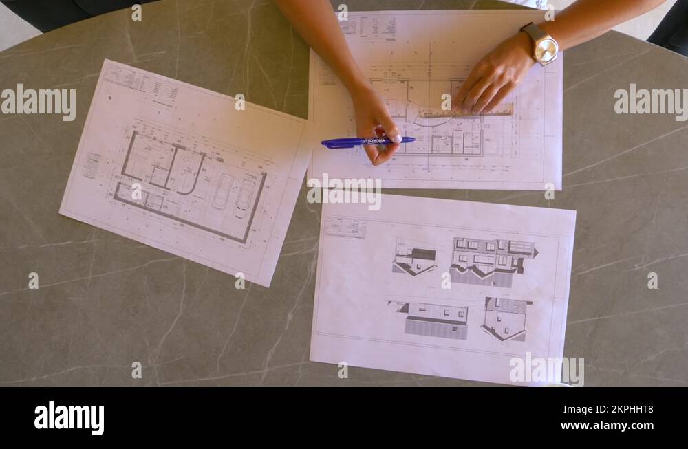 TOP DOWN: Female feng shui expert drawing energy lines on house ...