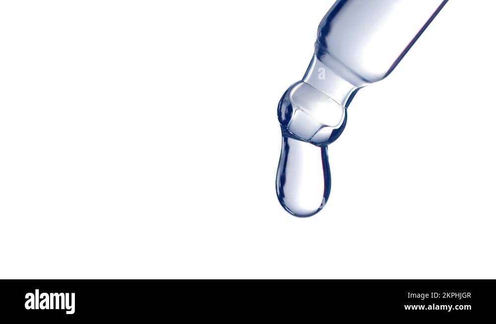 Drop of blue liquid falling from glass lab pipette isolated on white ...