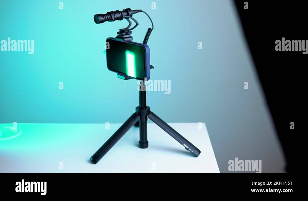 Closeup of live vlog setup with smarthone an dmicrophone on stand in ...
