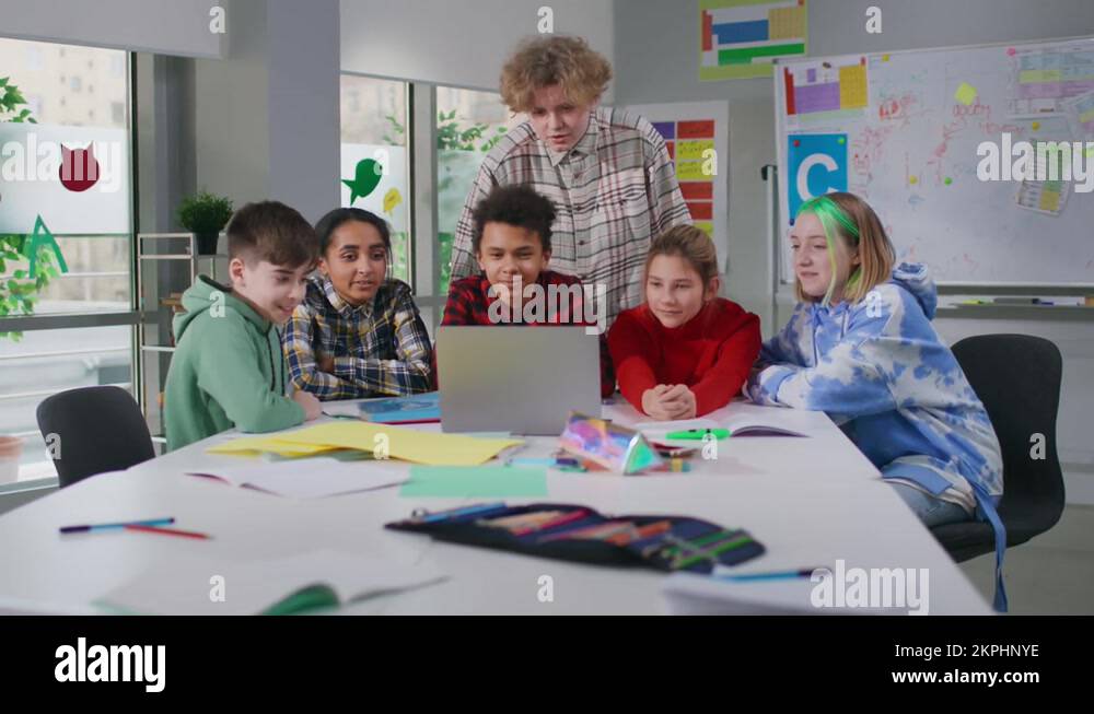 Group teenagers using together computer Stock Videos & Footage - HD and ...