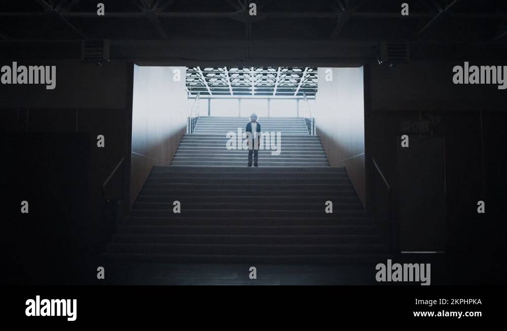 Lonely schoolboy posing standing empty school campus staircase after classes Stock Video Footage ...