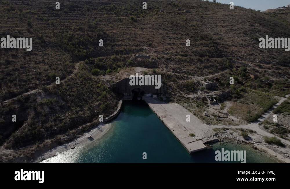 Dronie drone shot moving away from a World War II Bunker and ends up ...