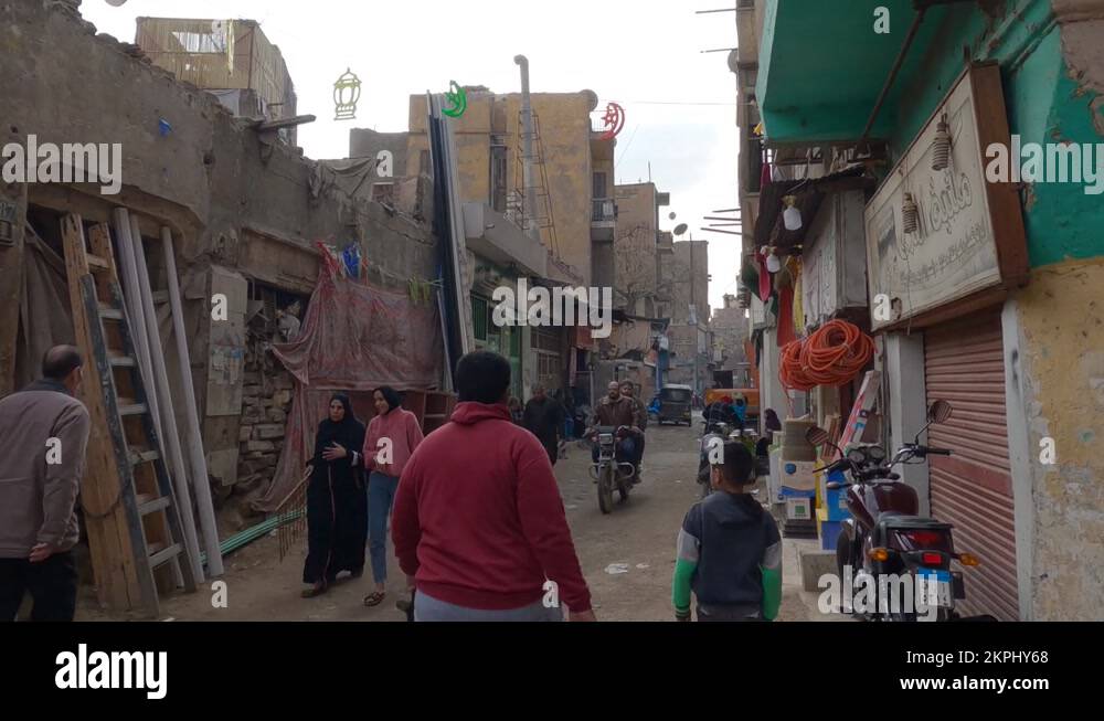 Egyptian people walking in pedestrian street of old Cairo historic town ...