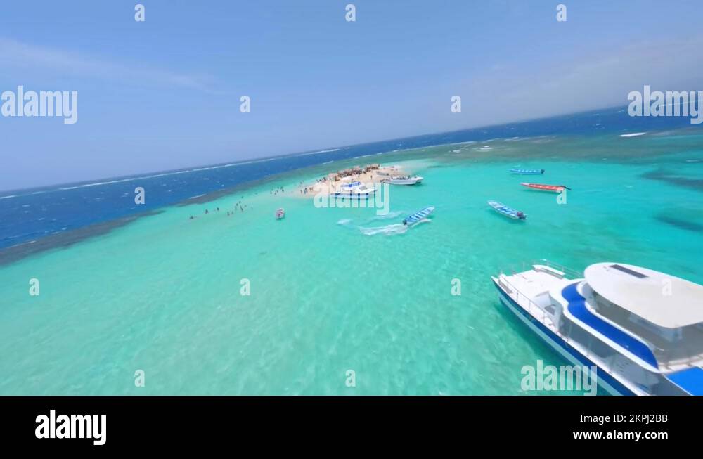 Coral islet sticks out above coral reef in Caribbean, Cayo Arena; FPV ...