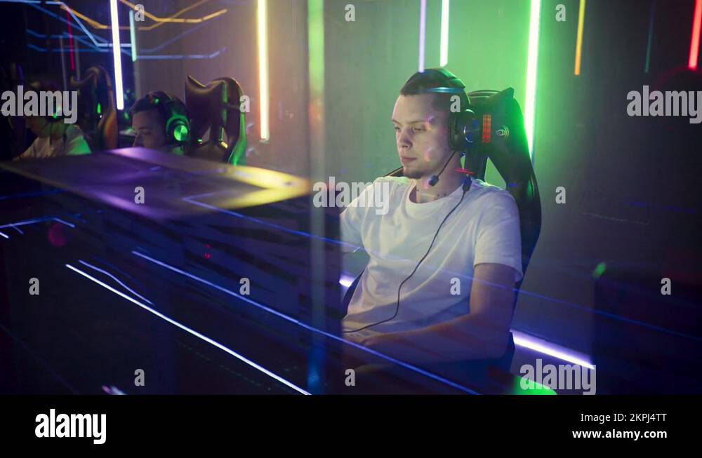 Gamer Guy Playing Digital Computer Games On Modern Powerful PC With RGB ...