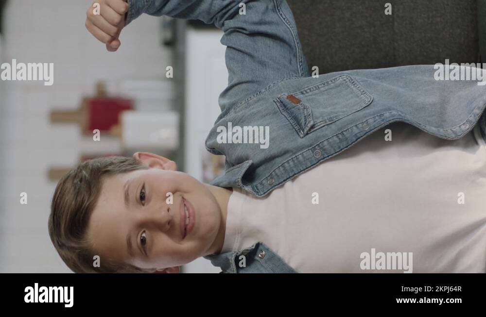 Little boy shows his arm muscles to the camera Stock Video Footage - Alamy